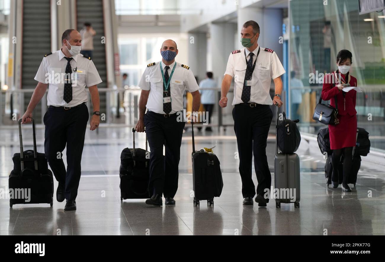 Flight crew members at the arrival hall at Hong Kong International ...