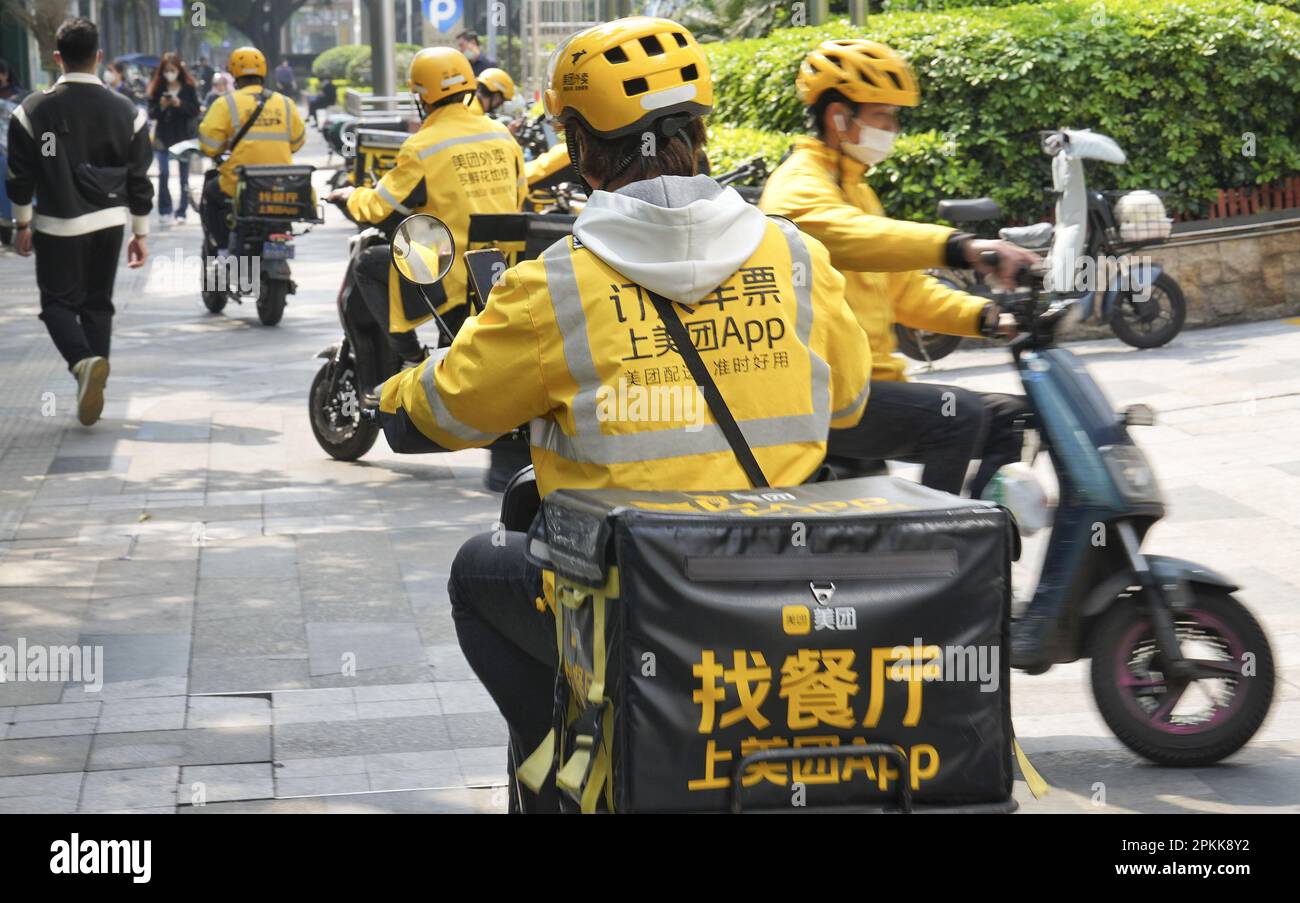 Food delivery riders of Meituan deliver takeaway food to customers on ...