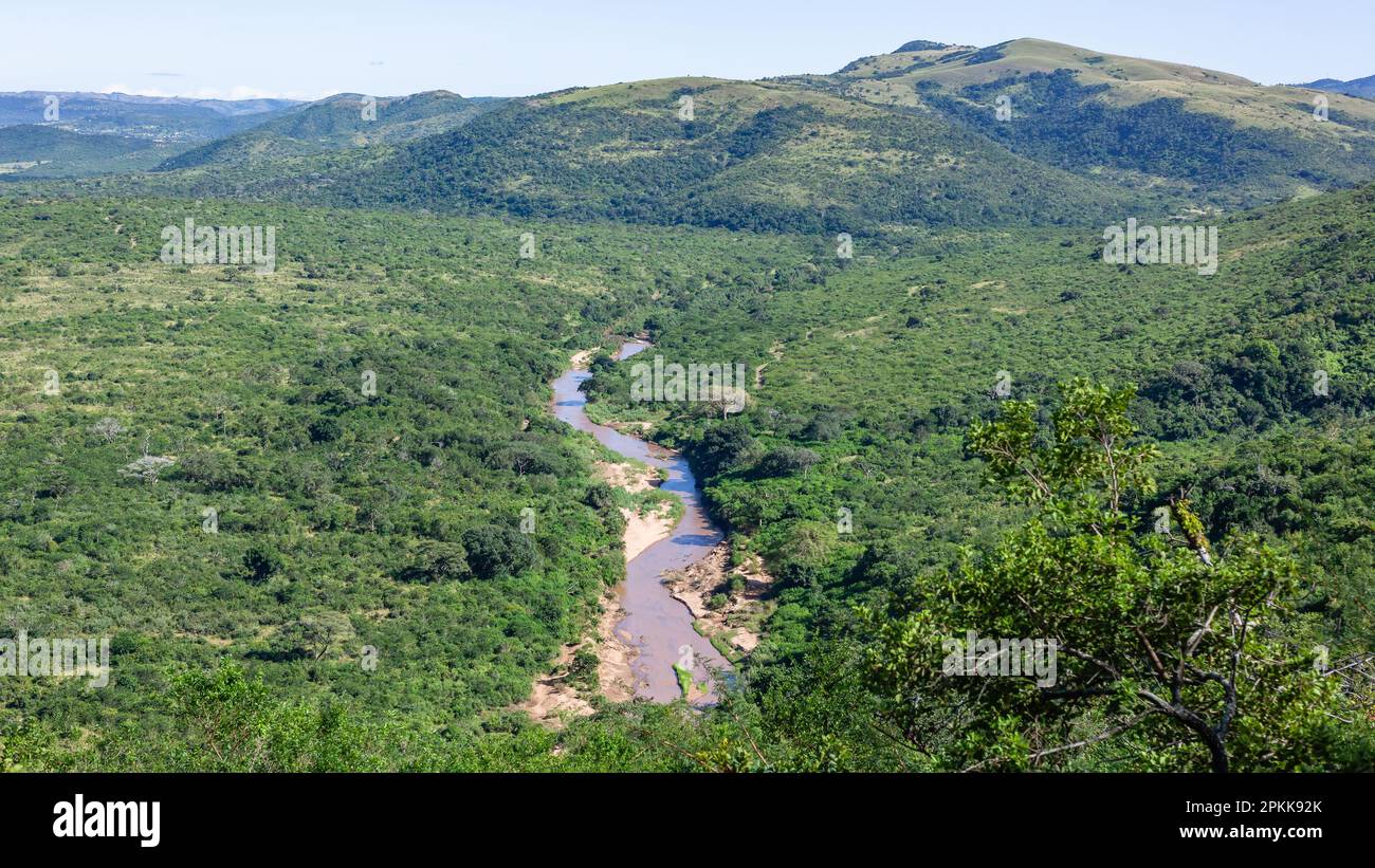 Wildlife animal reserve overlooking tropical valley with river , a ...