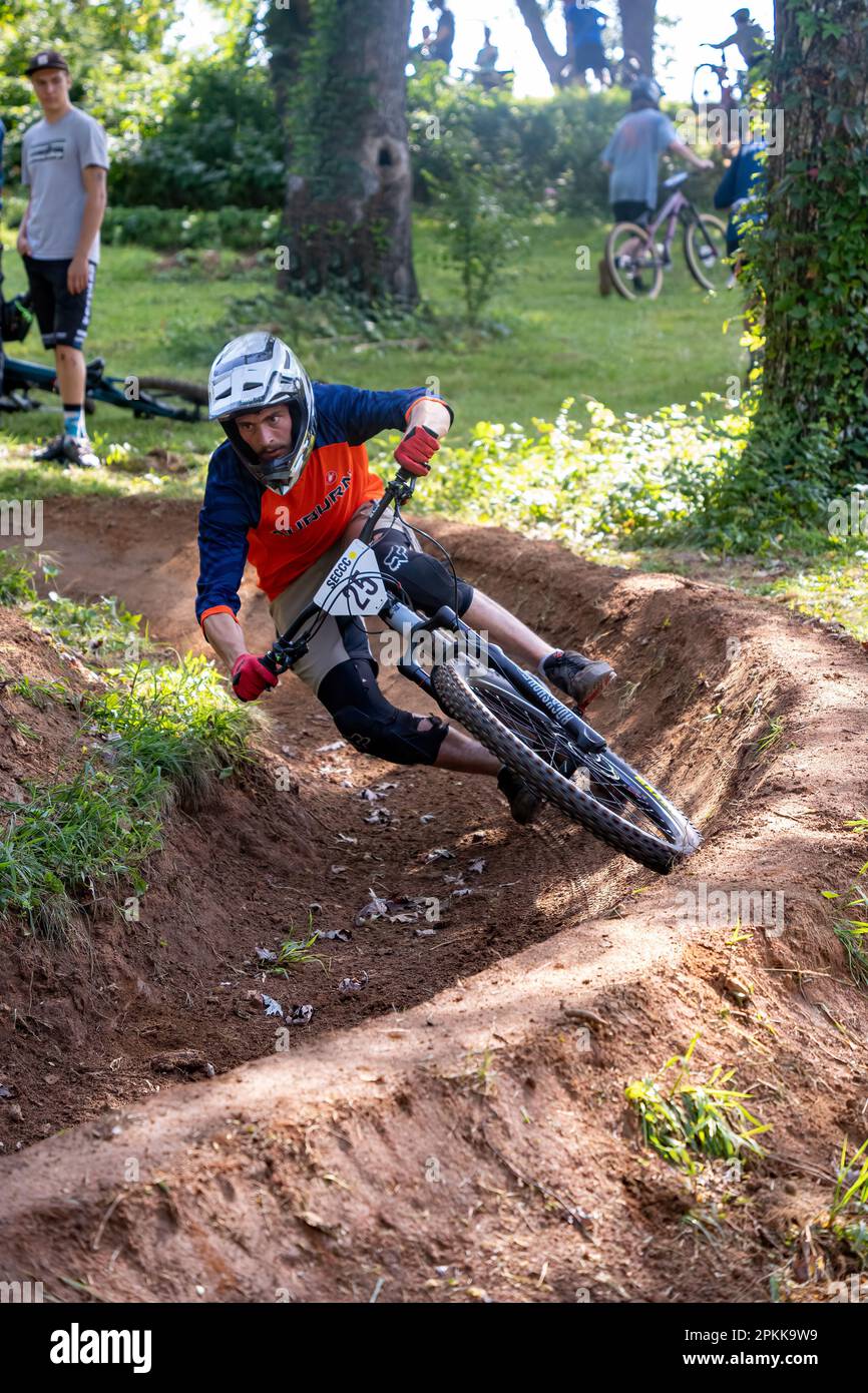 Mountain Bike Race intense focus in turn Stock Photo - Alamy