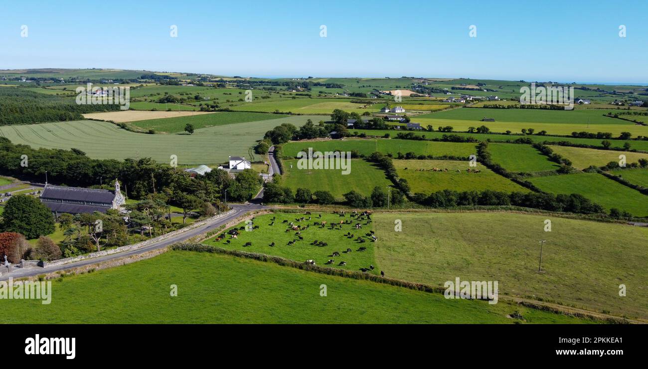 Old church and cemetery, green farm fields, top view. Picturesque ...