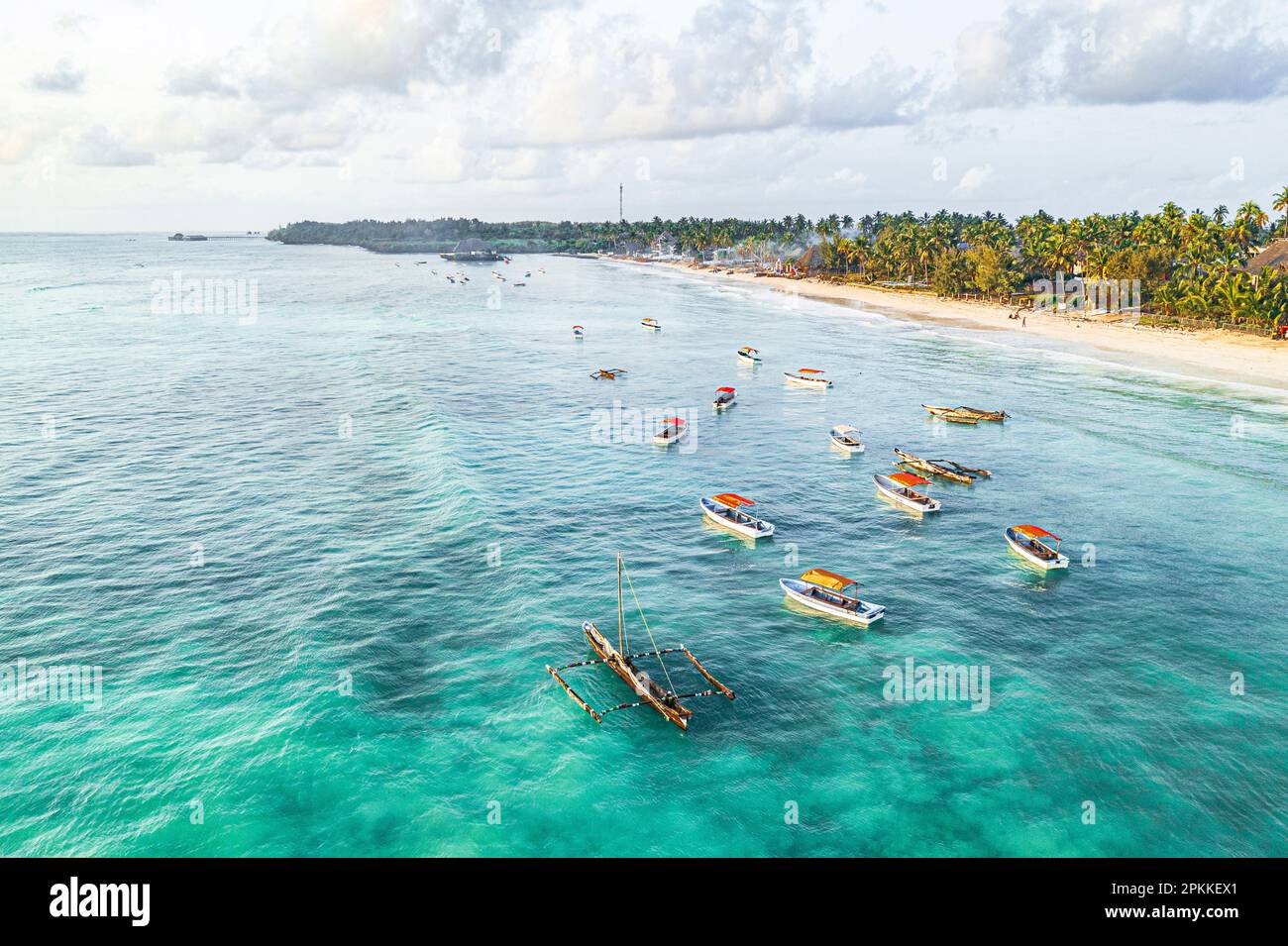 Aerial view of traditional dhow boats in the crystal sea, Pingwe ...