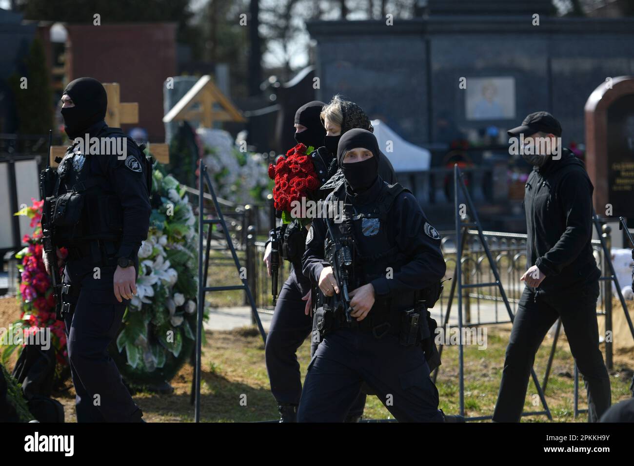 Armed Russian policemen guard an area during a funeral ceremony of ...