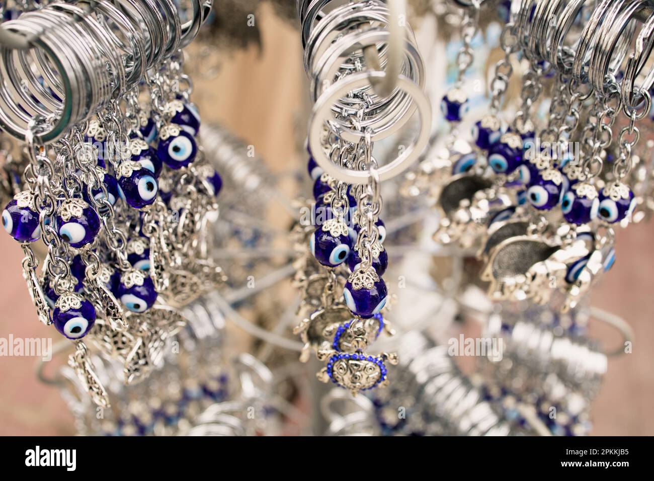 Keychains in the store with a Turkish eye symbol. Touristic souvenir ...
