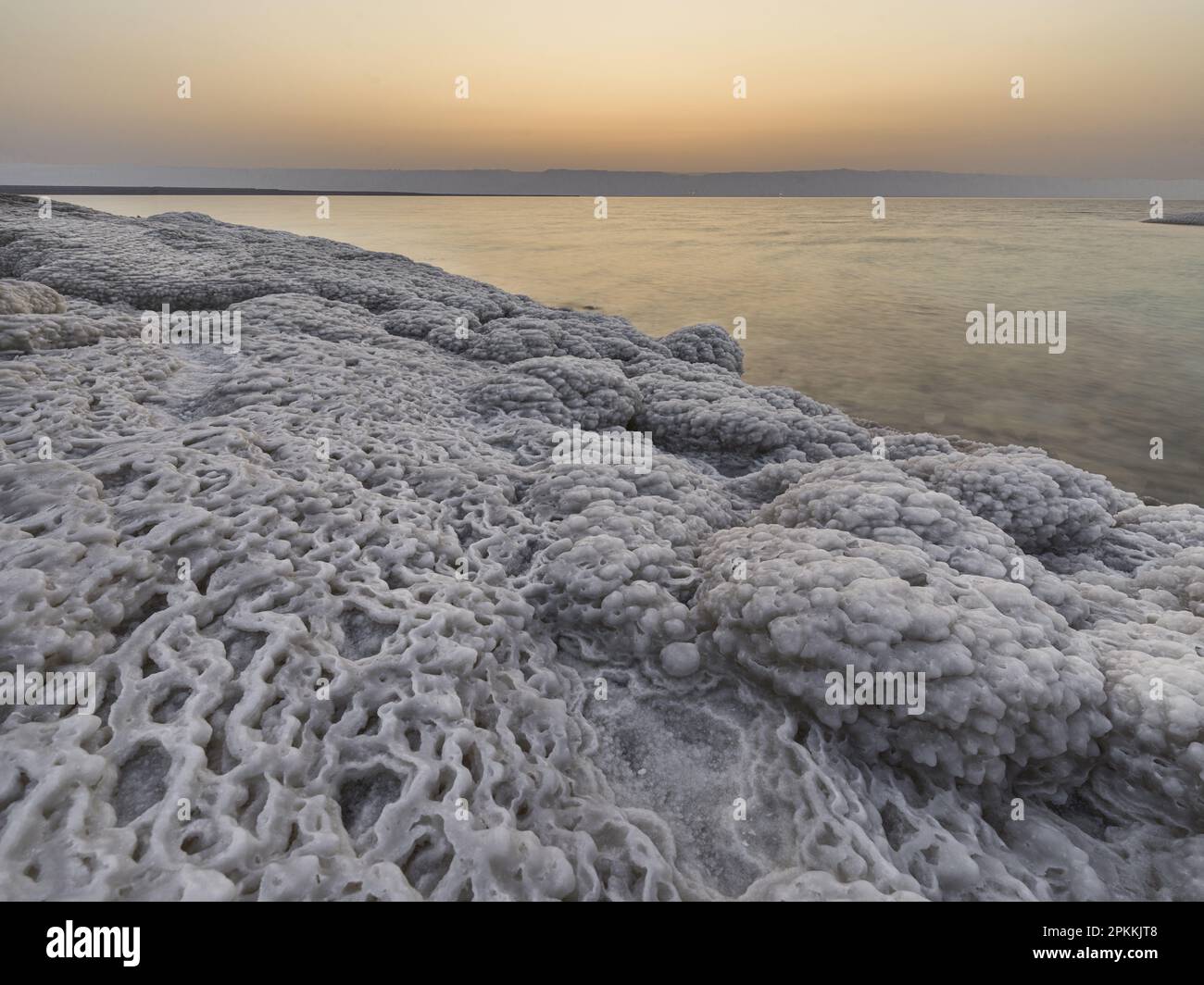 Dry salt incrustations on the shores of the Dead Sea, at dusk, Jordan ...