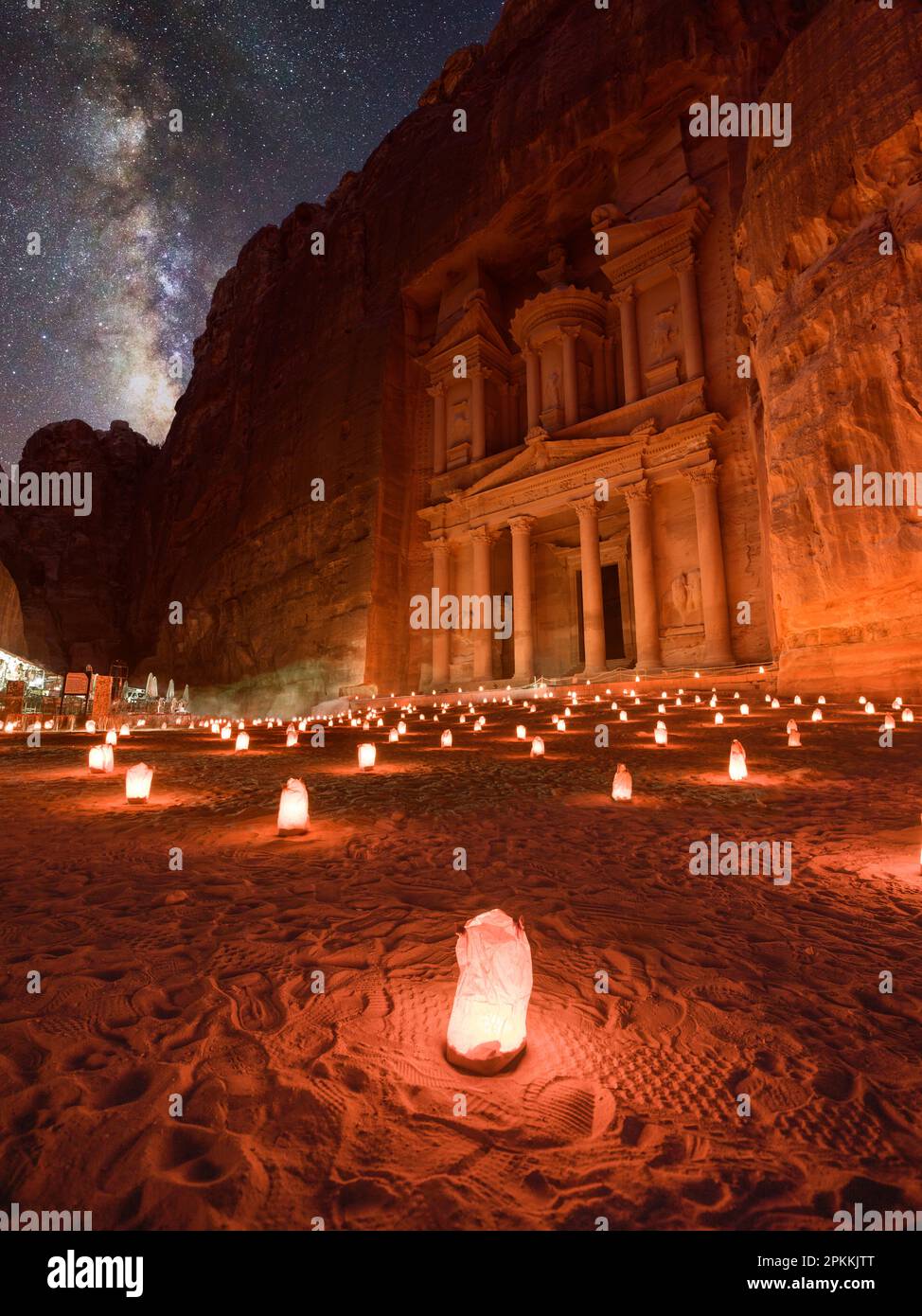 Petra Treasury (El Khazneh) by night illuminated by small lanterns and ...