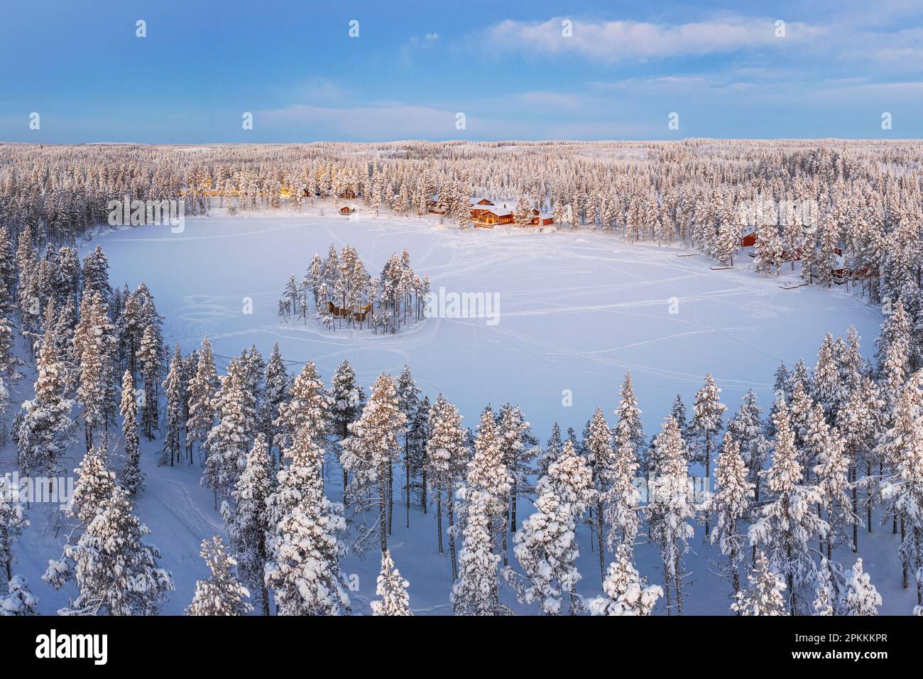 Aerial view of a tourist winter resort in the snow covered forest and ...