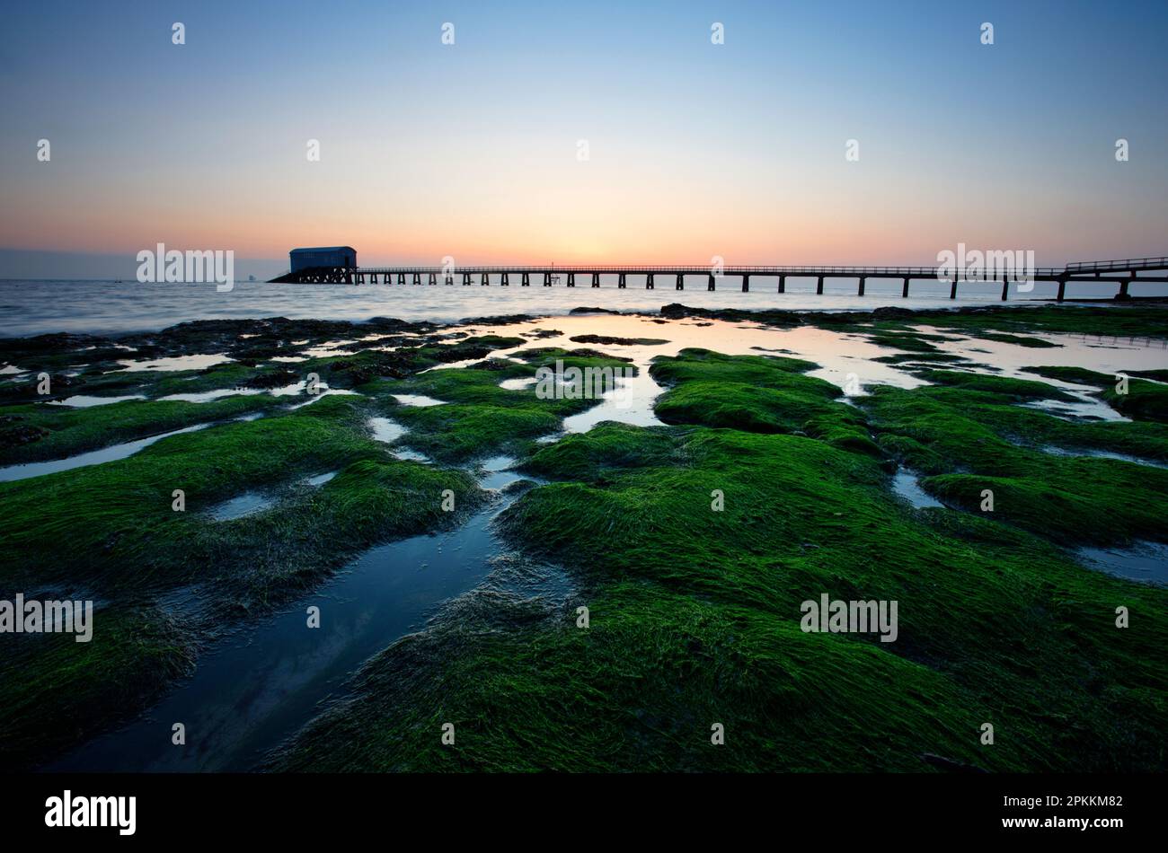 Bembridge Lifeboat Station and shoreline at dawn, Isle of Wight ...