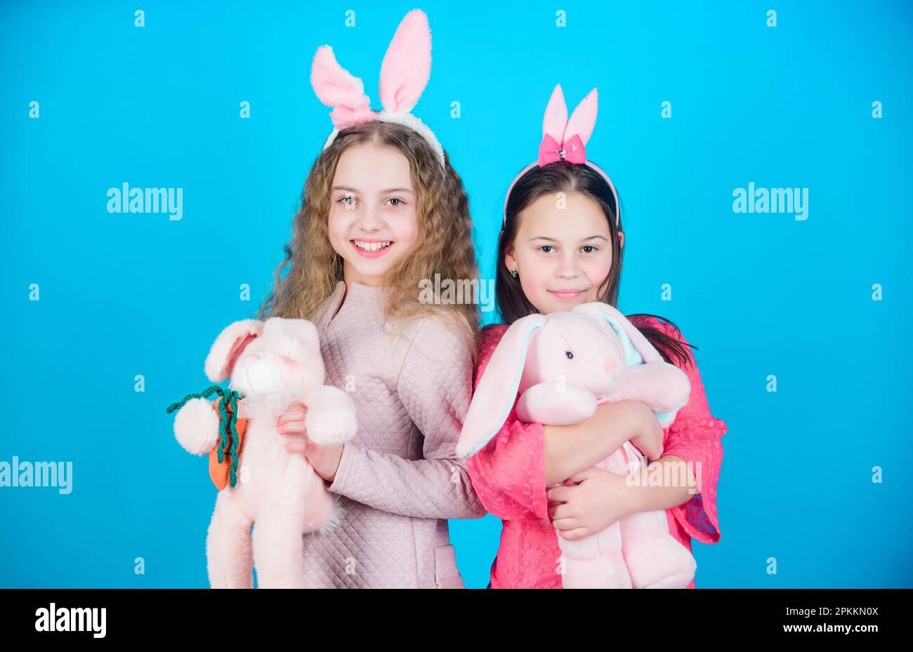 Bunny family. Children in rabbit bunny ears. Egg hunt. Family and ...