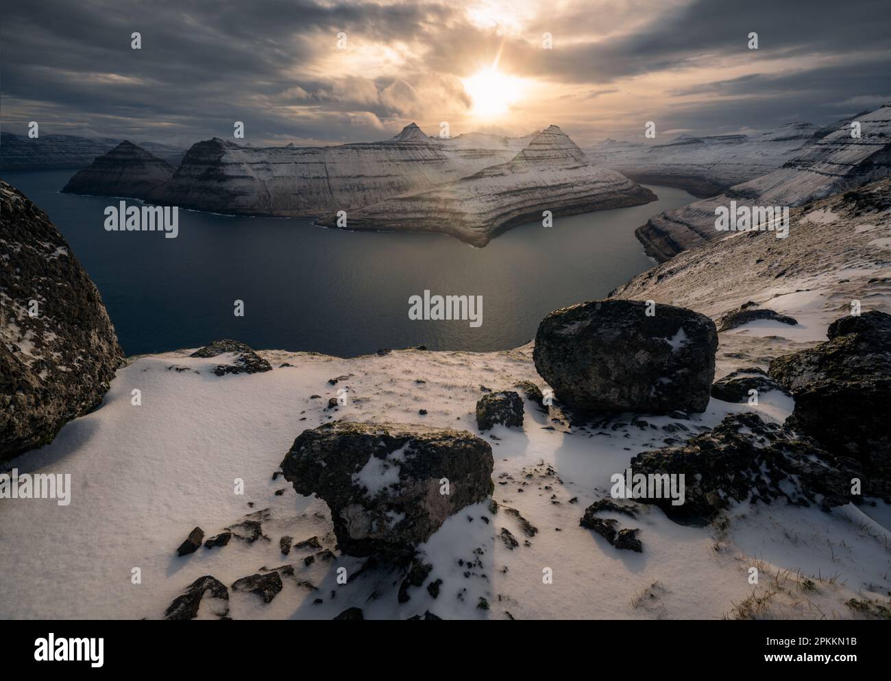 Snowy mountains in a remote fjord in winter, Faroe Islands, Denmark ...
