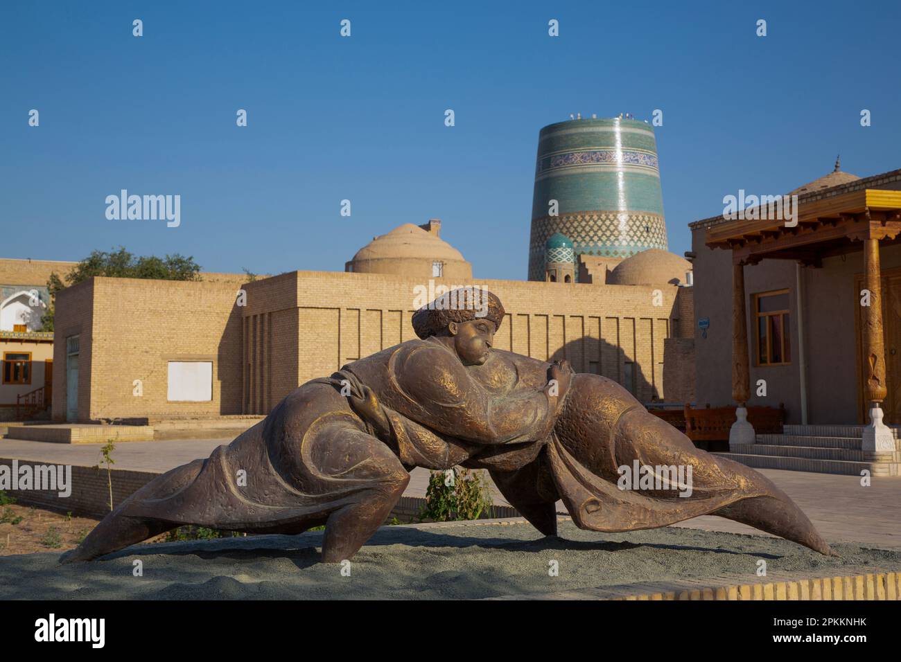 Sculpture with Kalta Minaret in the background, Ichon Qala (Itchan Kala ...