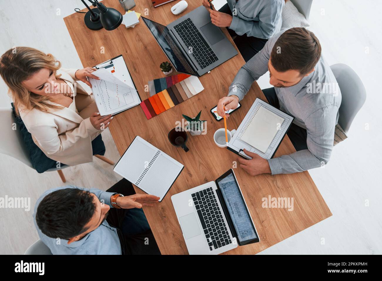 Top view. Group of business people that working on the project in the ...