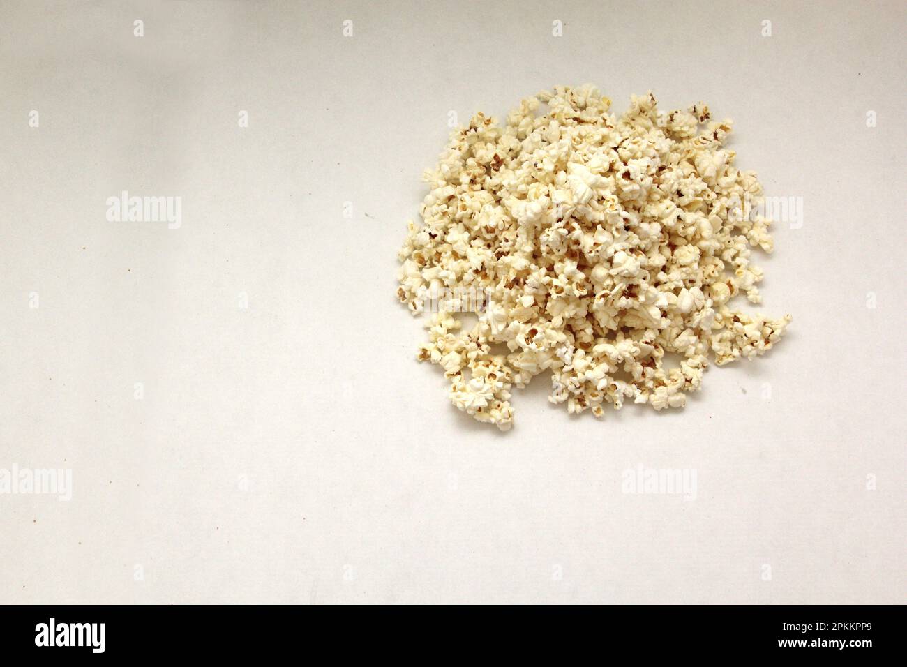Natural popcorn with natural corn in a container or paper bag ready for ...