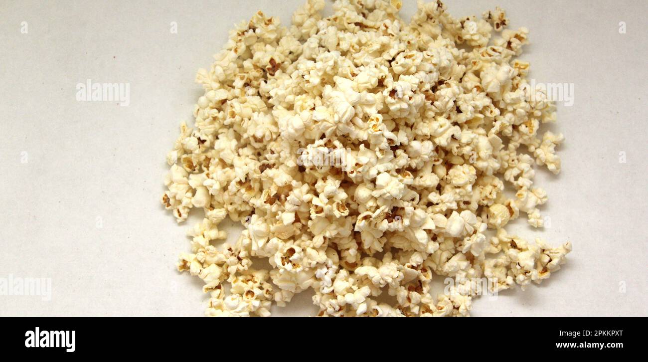 Natural popcorn with natural corn in a container or paper bag ready for ...