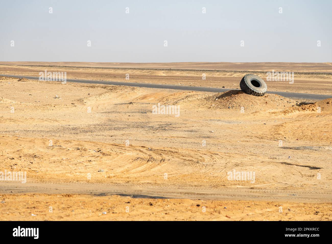 An abandoned tyre by the side of a road in a desert in Egypt Stock ...
