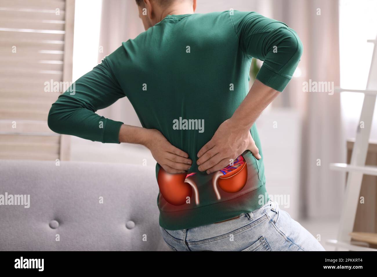 Man suffering from kidney pain at home, closeup Stock Photo - Alamy