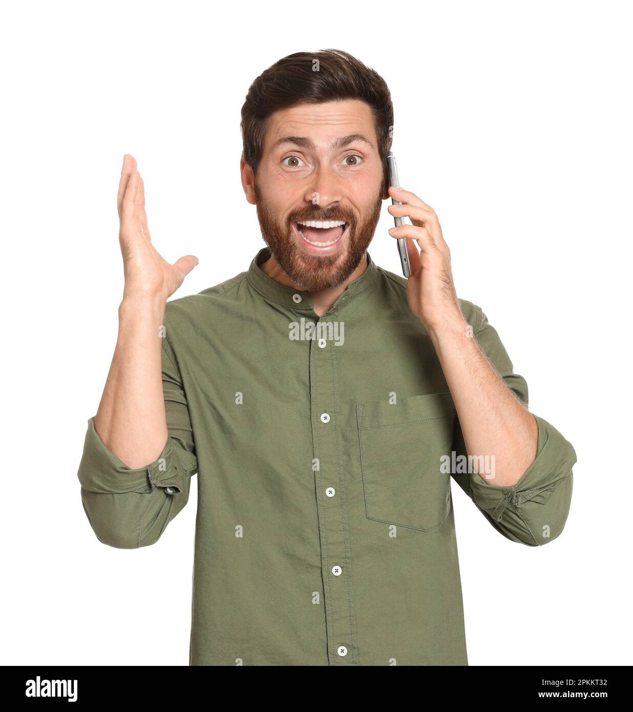 Emotional man talking on phone against white background Stock Photo - Alamy
