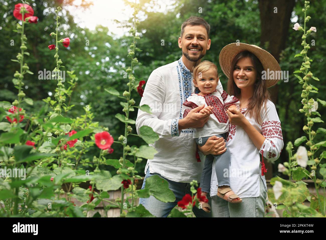 Happy family in Ukrainian national clothes outdoors Stock Photo - Alamy