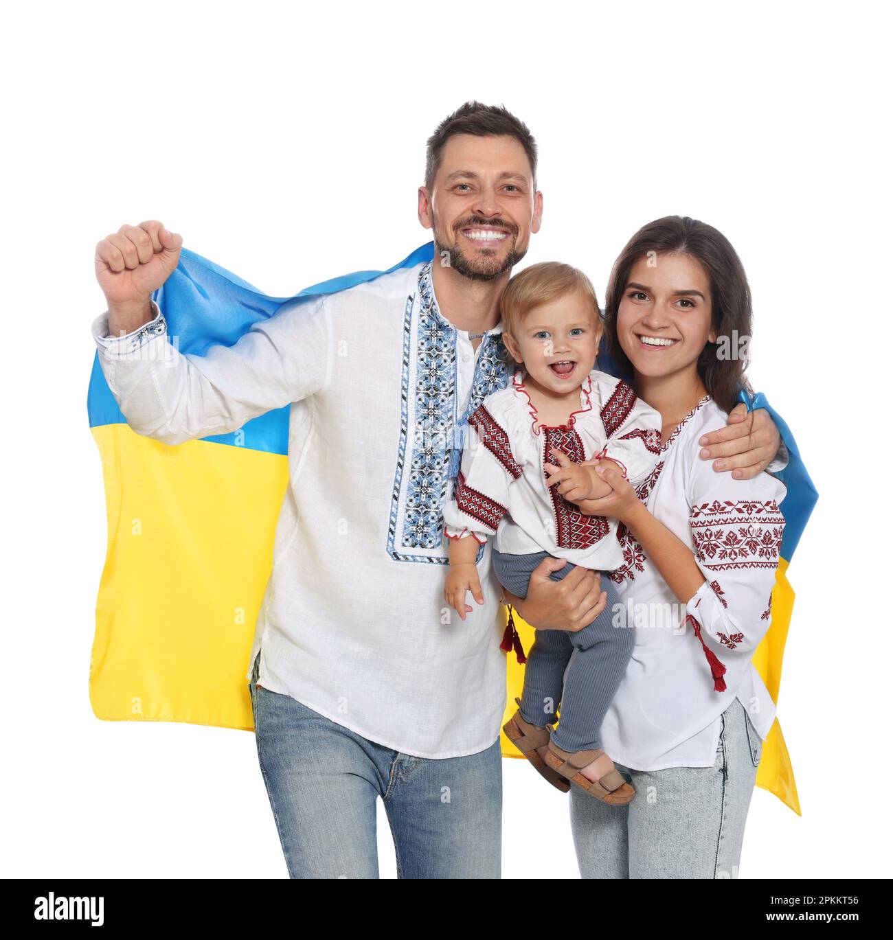 Happy family in national clothes with flag of Ukraine on white ...