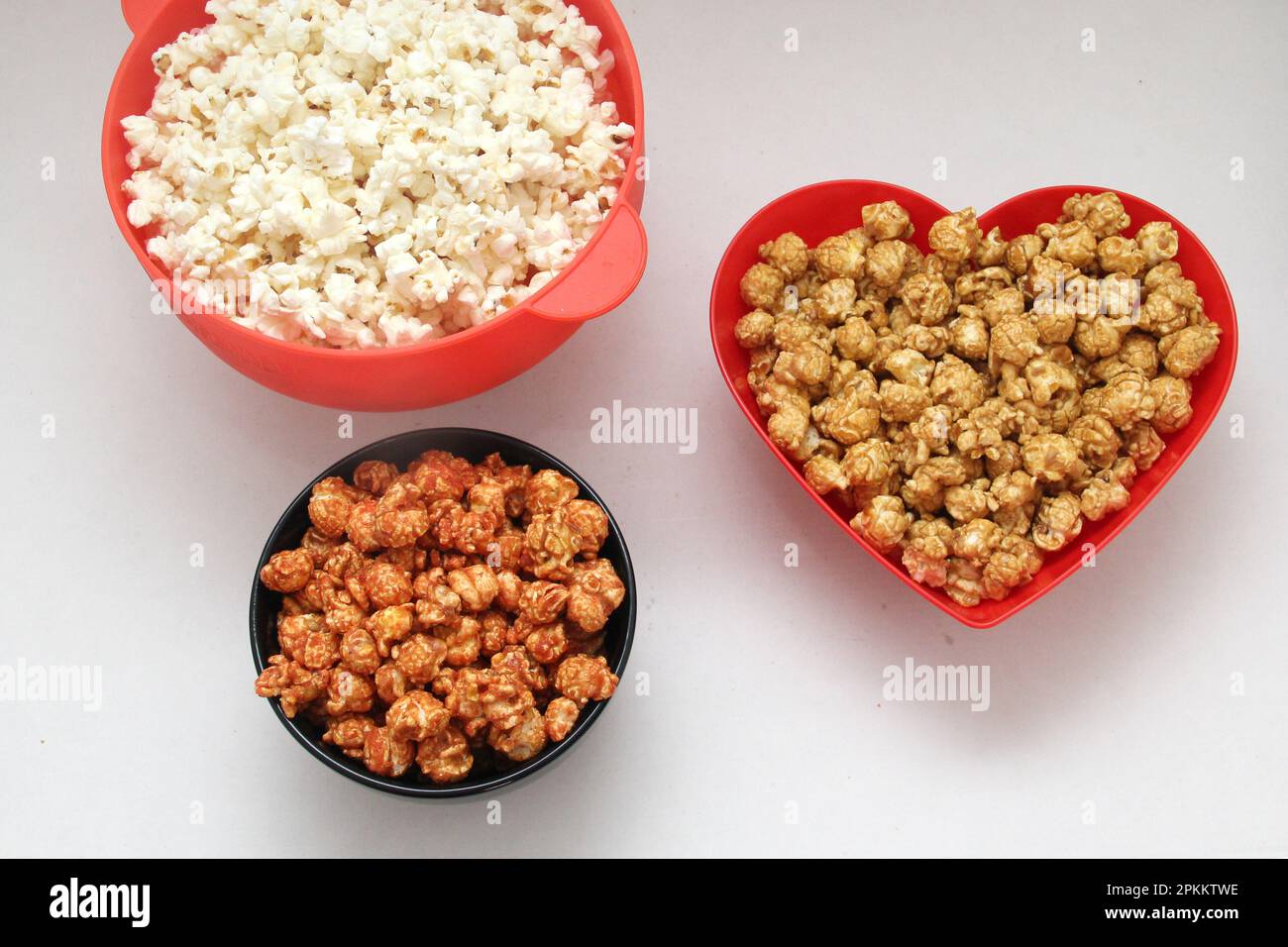 Flavored popcorn: natural, with chili and with caramel, Variety of ...