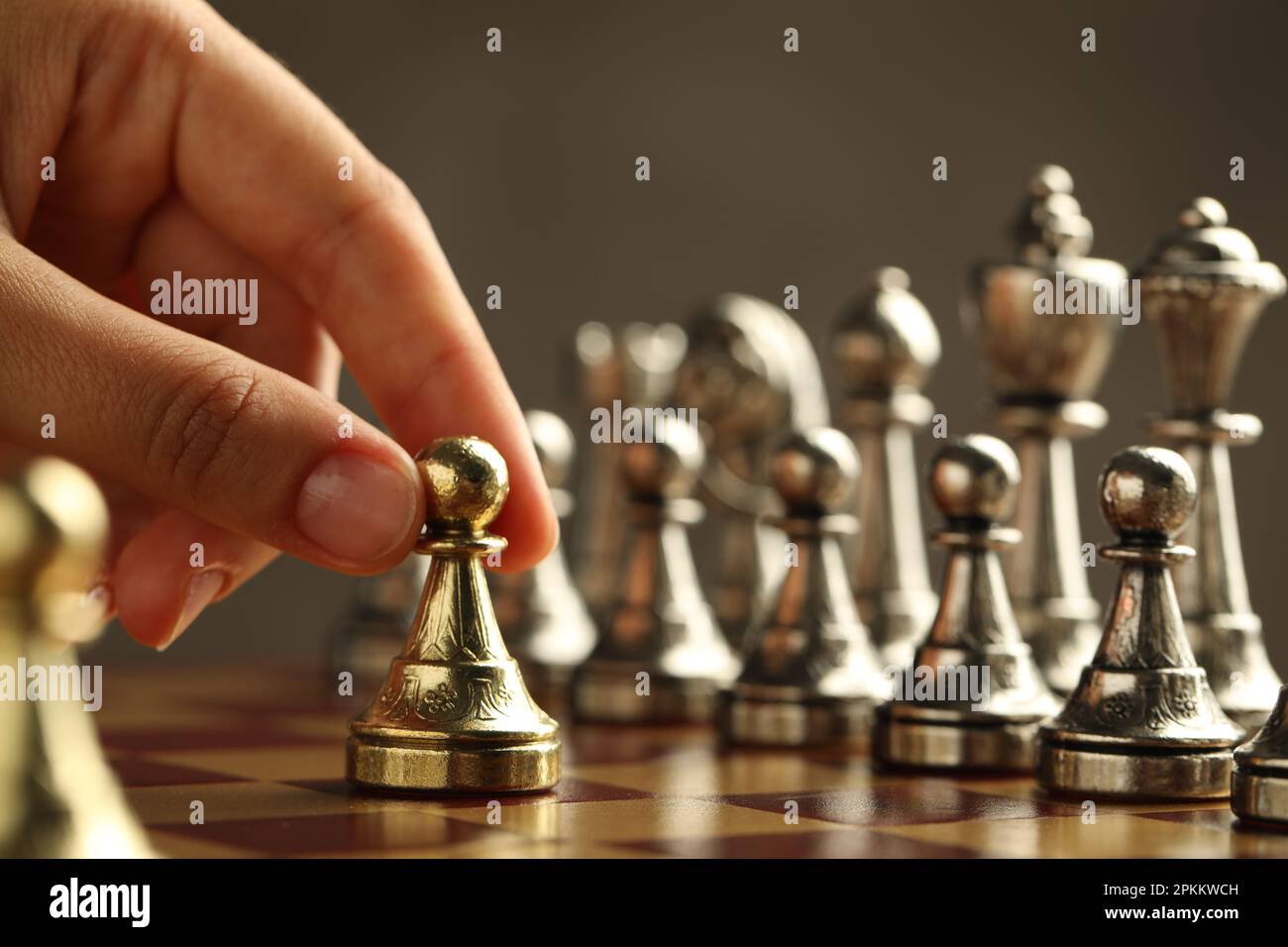 Woman moving chess piece on board, closeup Stock Photo - Alamy