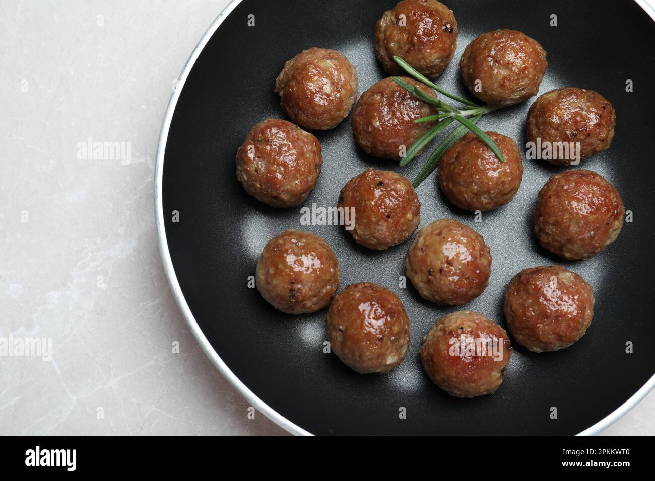 Tasty cooked meatballs on light grey marble table, top view Stock Photo ...