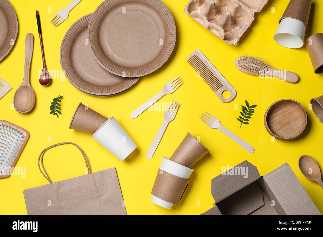 Different eco items on yellow background, flat lay. Recycling concept ...