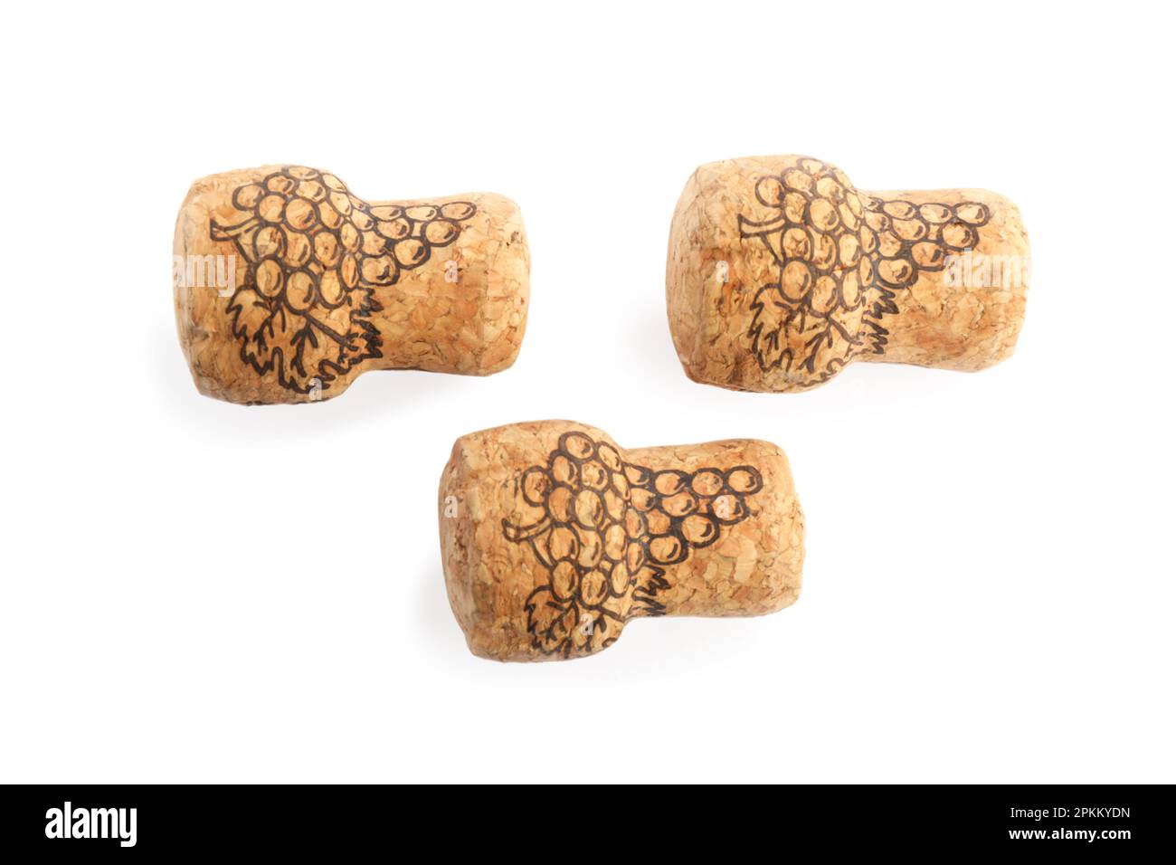 Sparkling wine corks with grape images on white background, top view ...