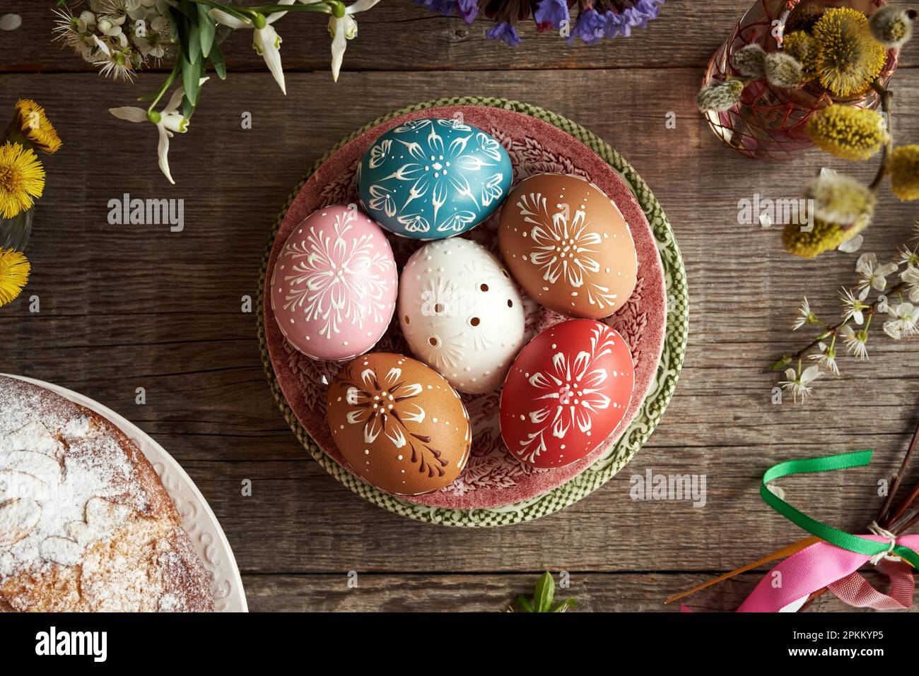 Colorful Easter eggs decorated with wax with spring flowers and mazanec ...