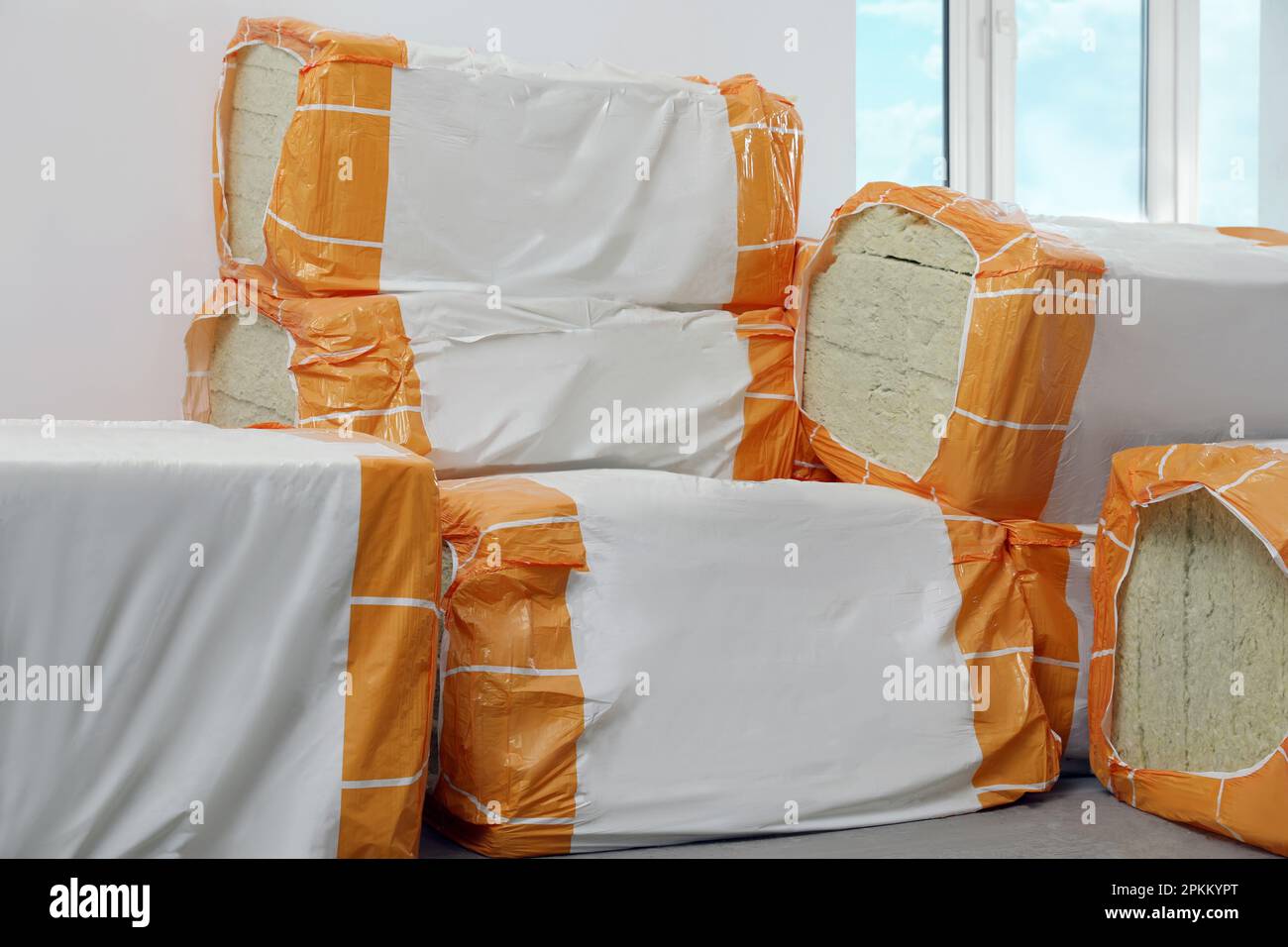 Packages of thermal insulation material in room Stock Photo - Alamy
