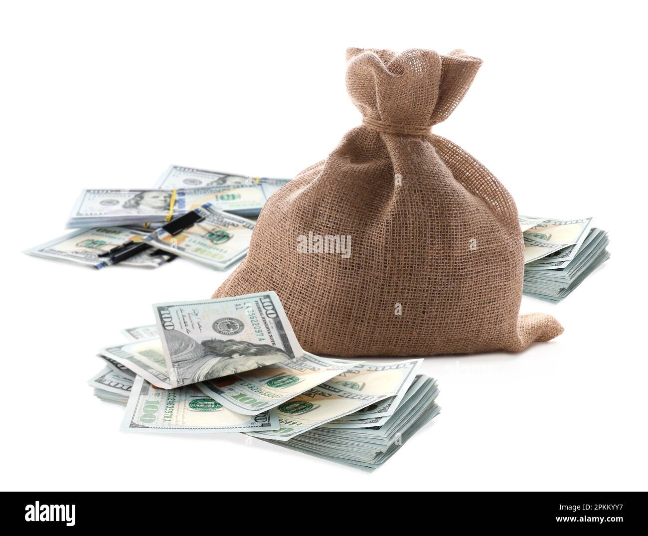 Burlap bag and dollar banknotes on white background Stock Photo - Alamy