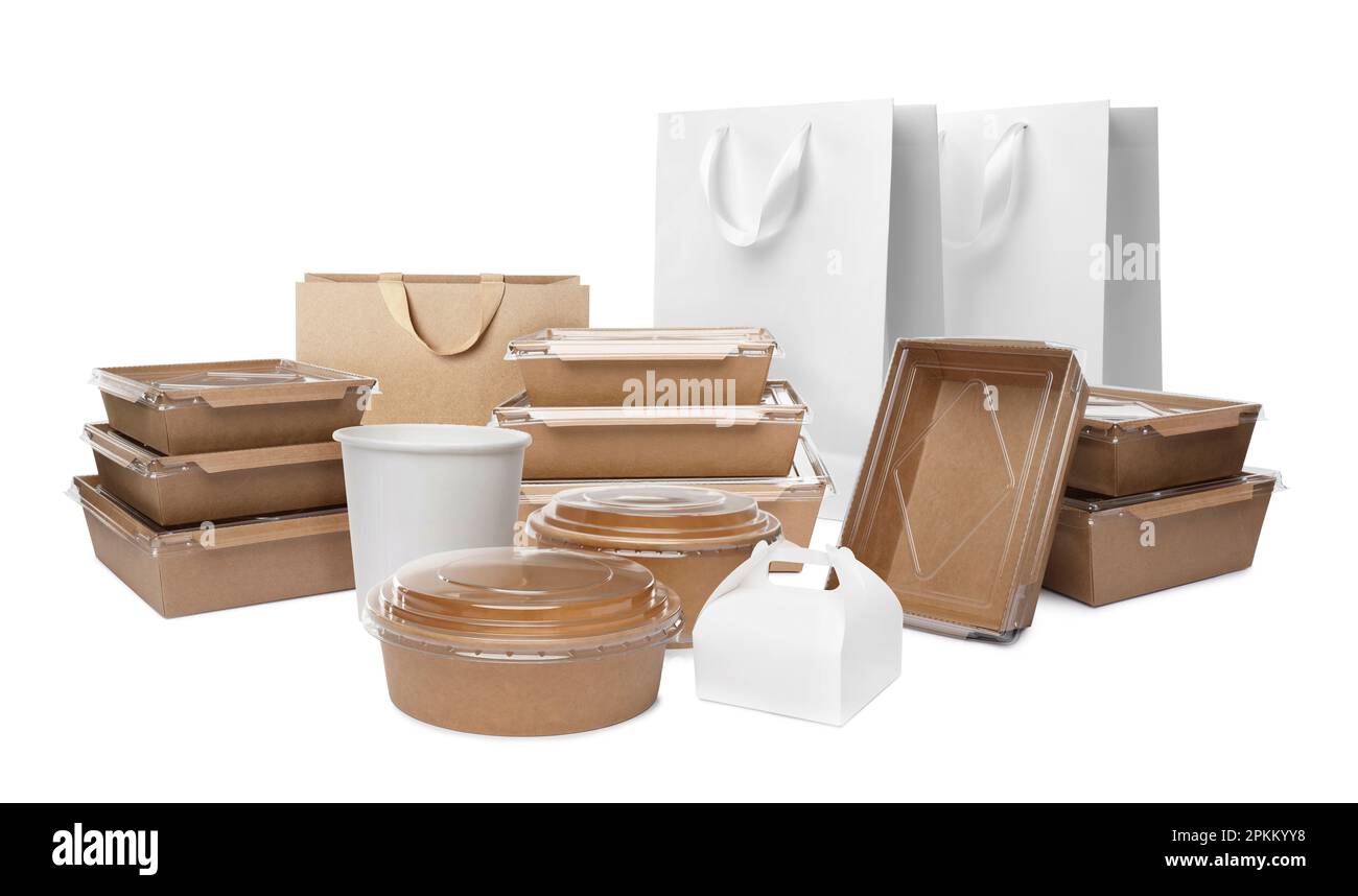 Set with different paper bags and containers for food on white ...