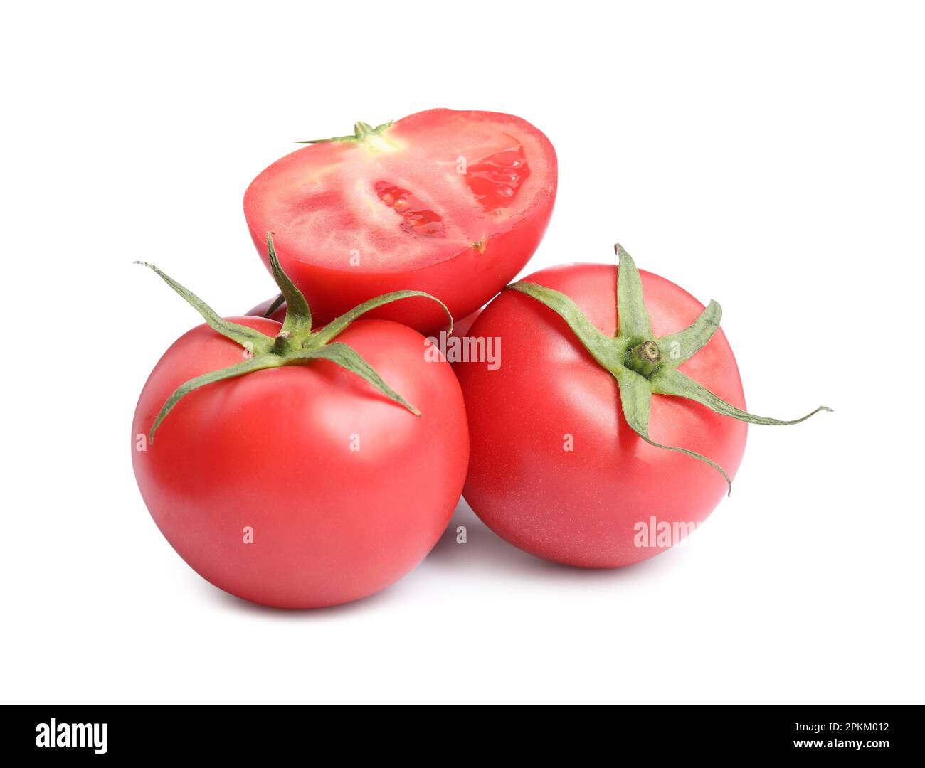 Whole and cut red tomatoes on white background Stock Photo - Alamy