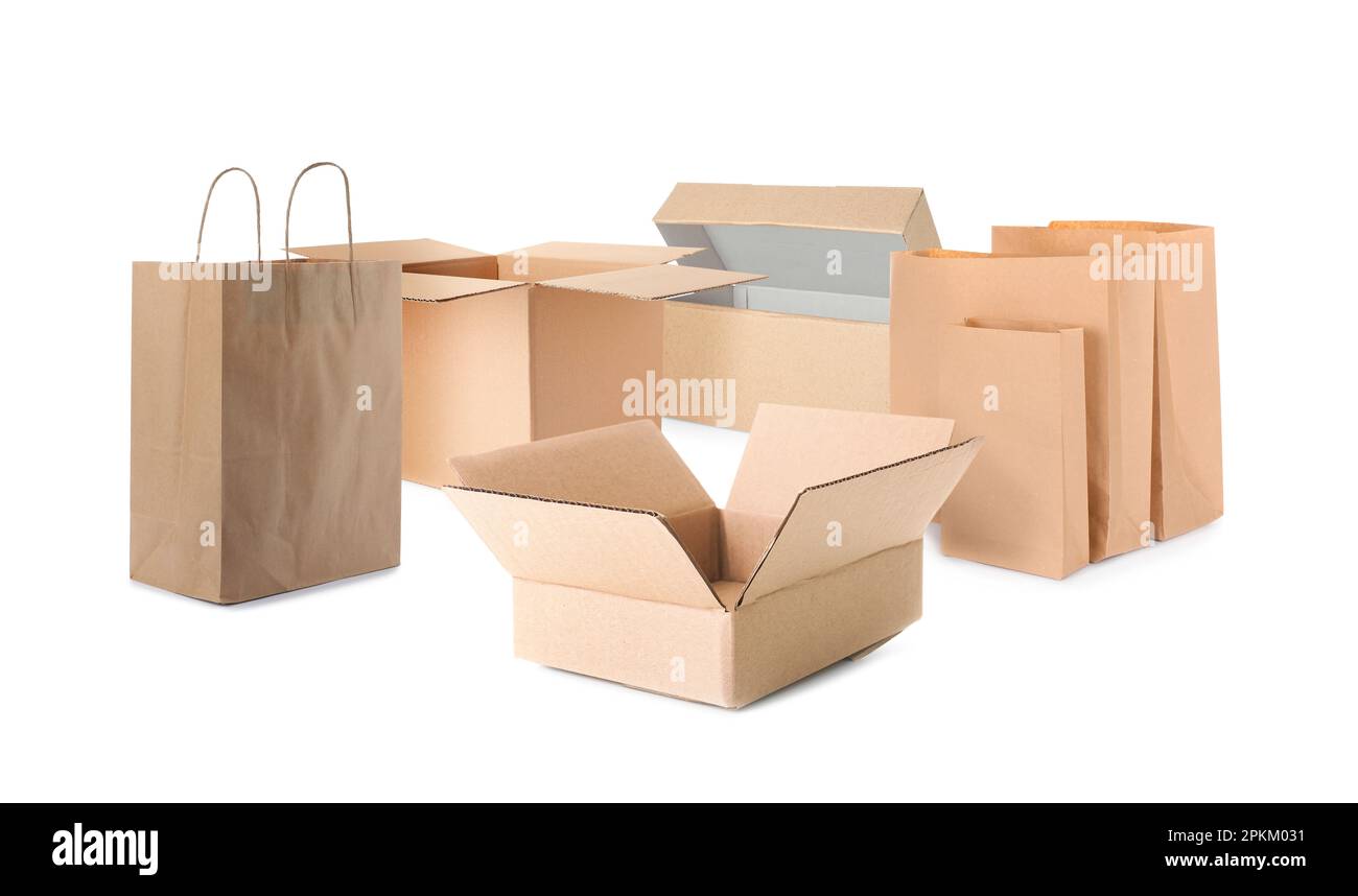 Set with different paper bags and cardboard boxes on white background ...