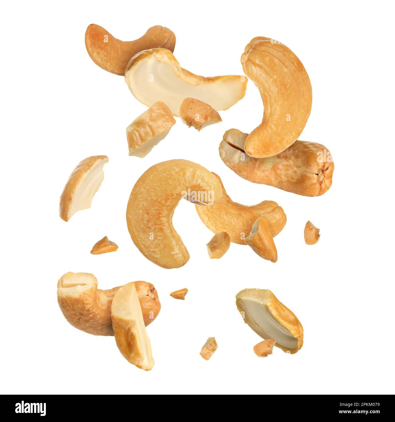 Tasty cashew nuts flying on white background Stock Photo - Alamy