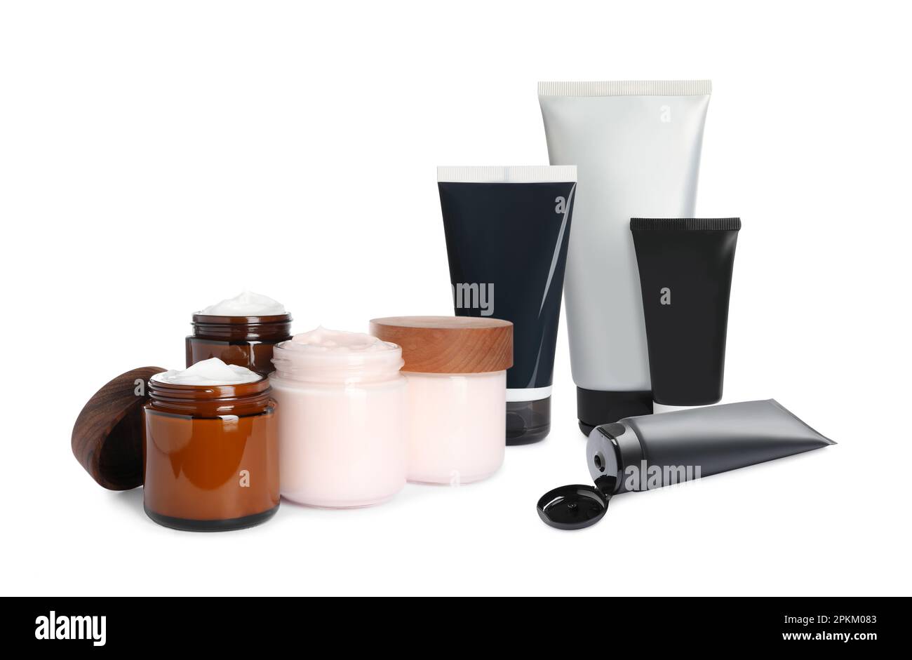 Set with tubes and jars of facial cream on white background Stock Photo ...