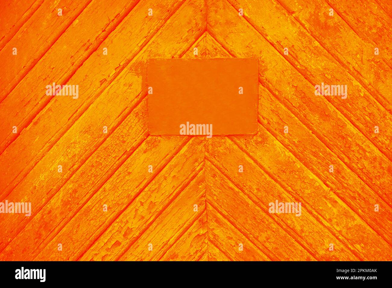Textured orange wooden surface with stained signboard as background ...