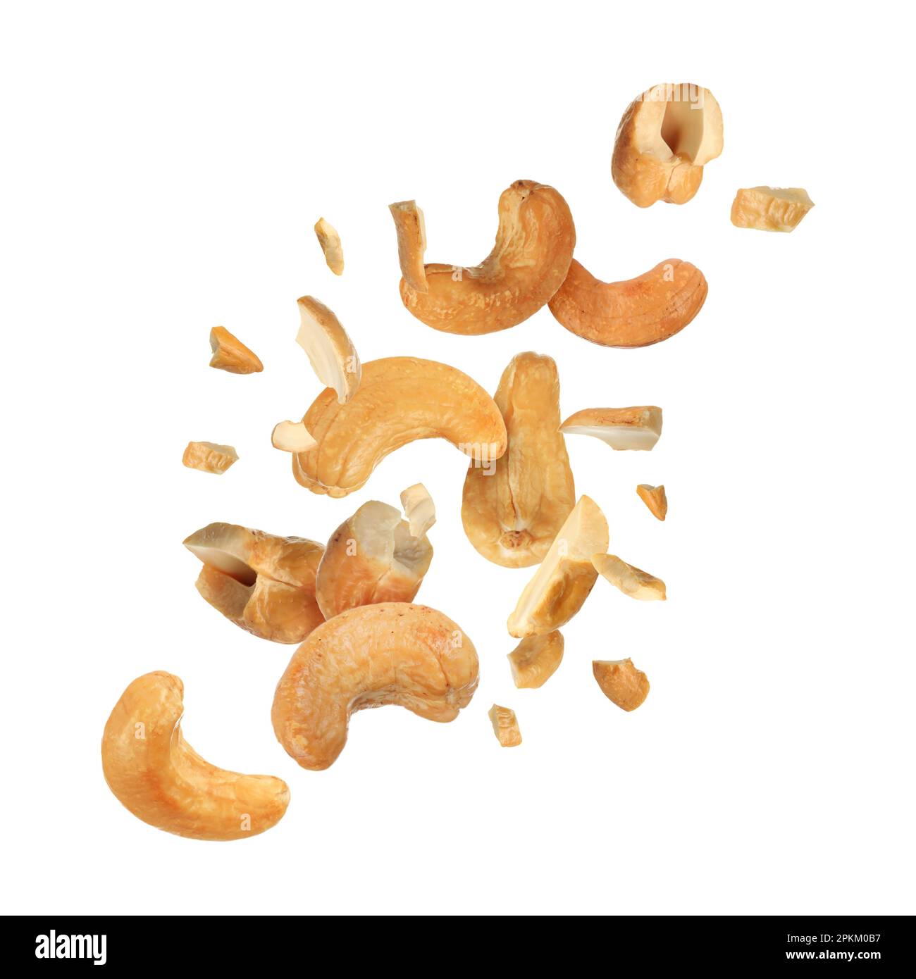 Tasty cashew nuts flying on white background Stock Photo - Alamy