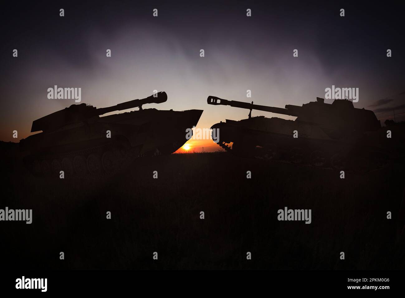 Silhouettes of tanks on battlefield in night Stock Photo - Alamy