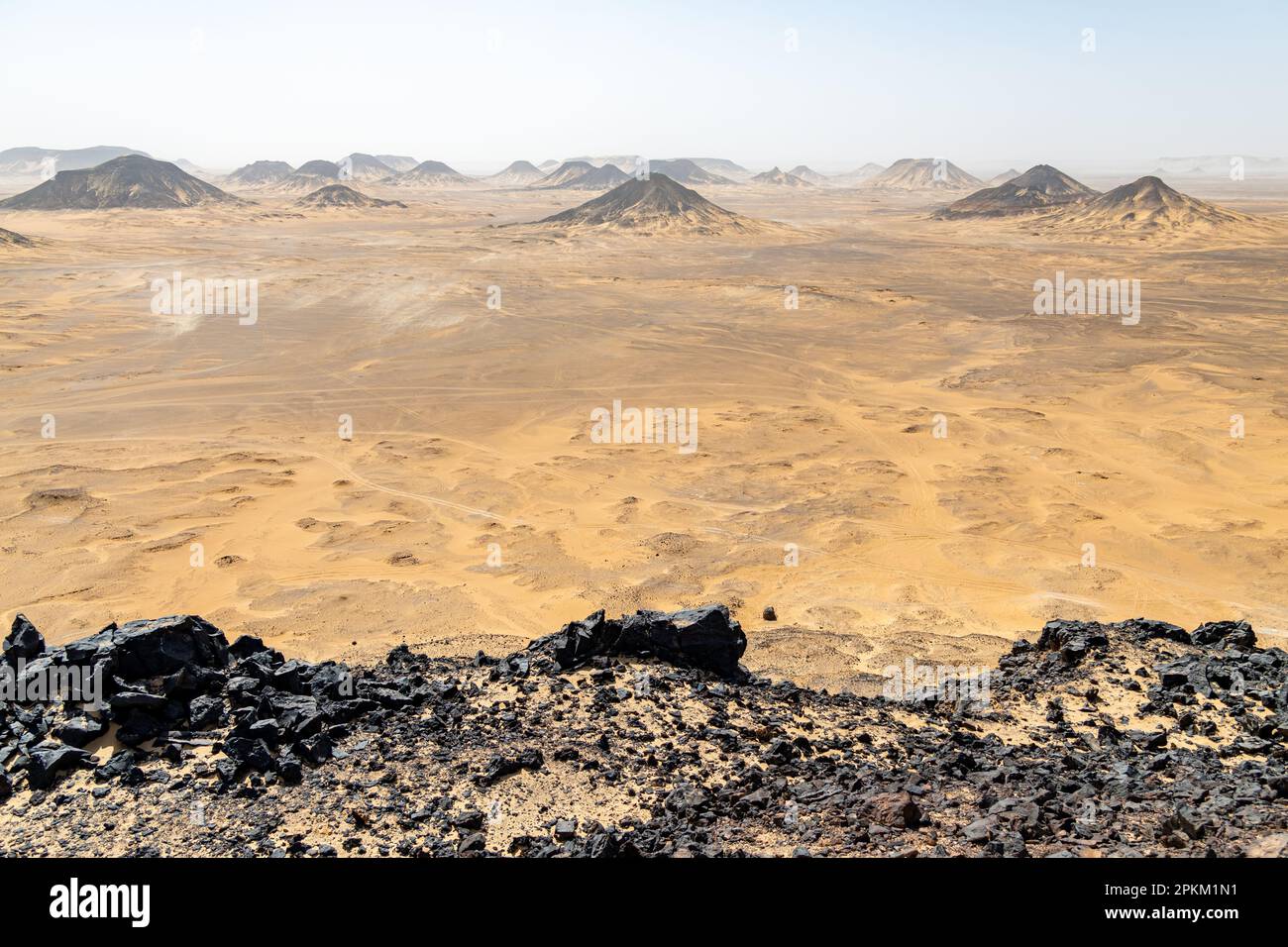 A view of the rocky outcrops / basalt mounds in the Black Desert in ...