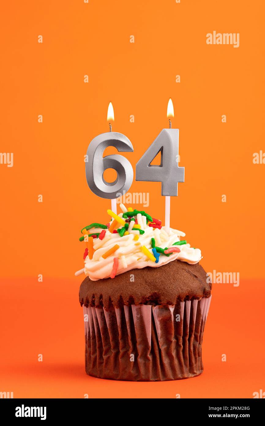 Birthday cake with candle number 64 - Orange foamy background Stock ...