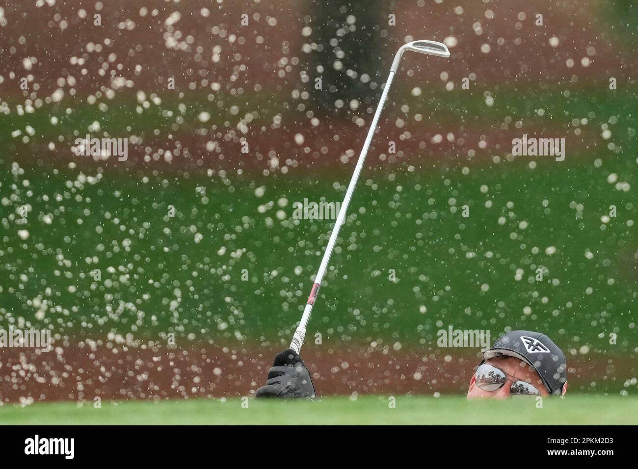 Phil Mickelson watches his shot from the bunker on the seventh hole ...