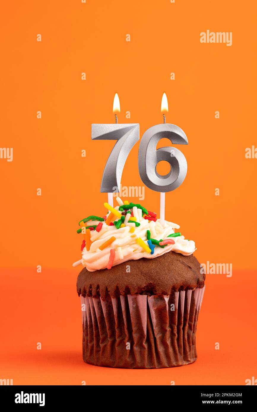Birthday cake with candle number 76 - Orange foamy background Stock ...