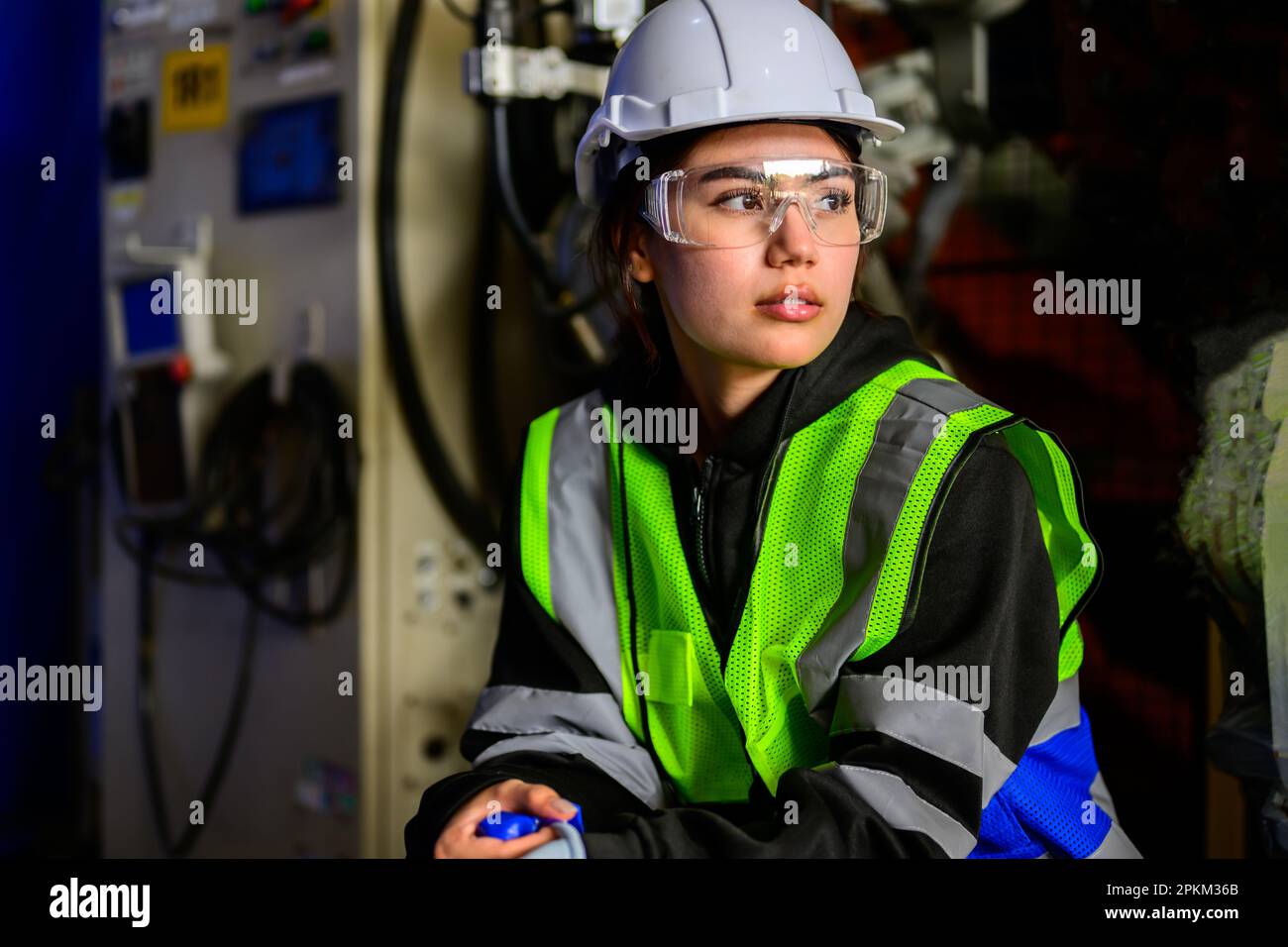Professional maintenance worker working with robotic arms machine Stock ...