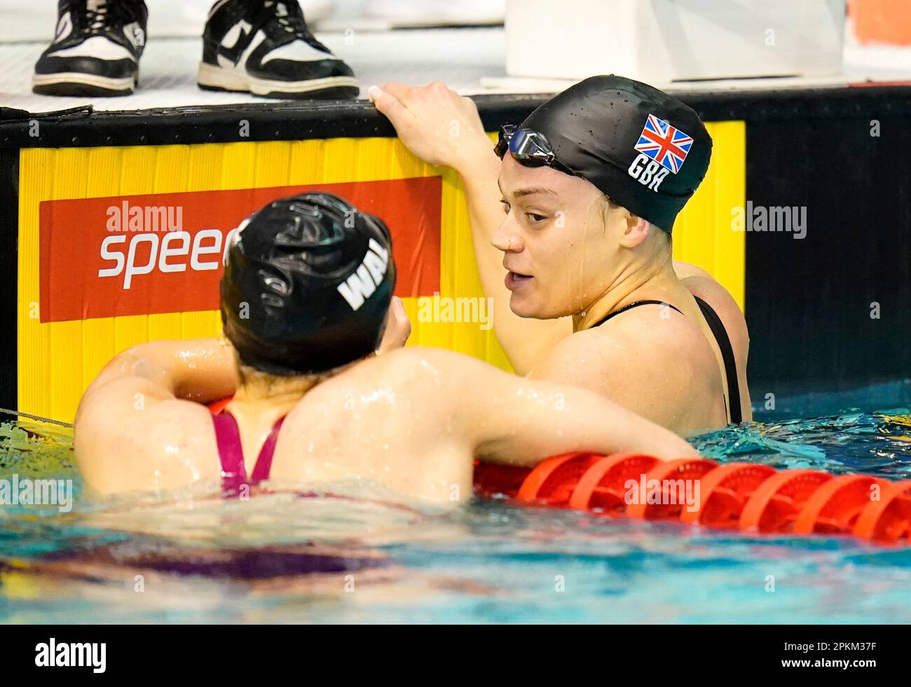 Lauren Cox (right) is congratulated by Medi Harris after winning the ...