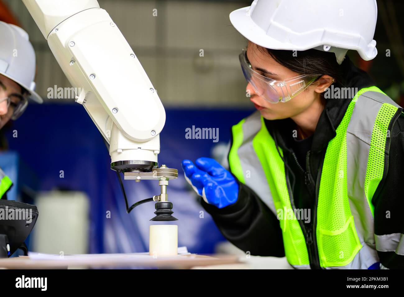 Happy female maintenance workers working at industrial factory Stock ...