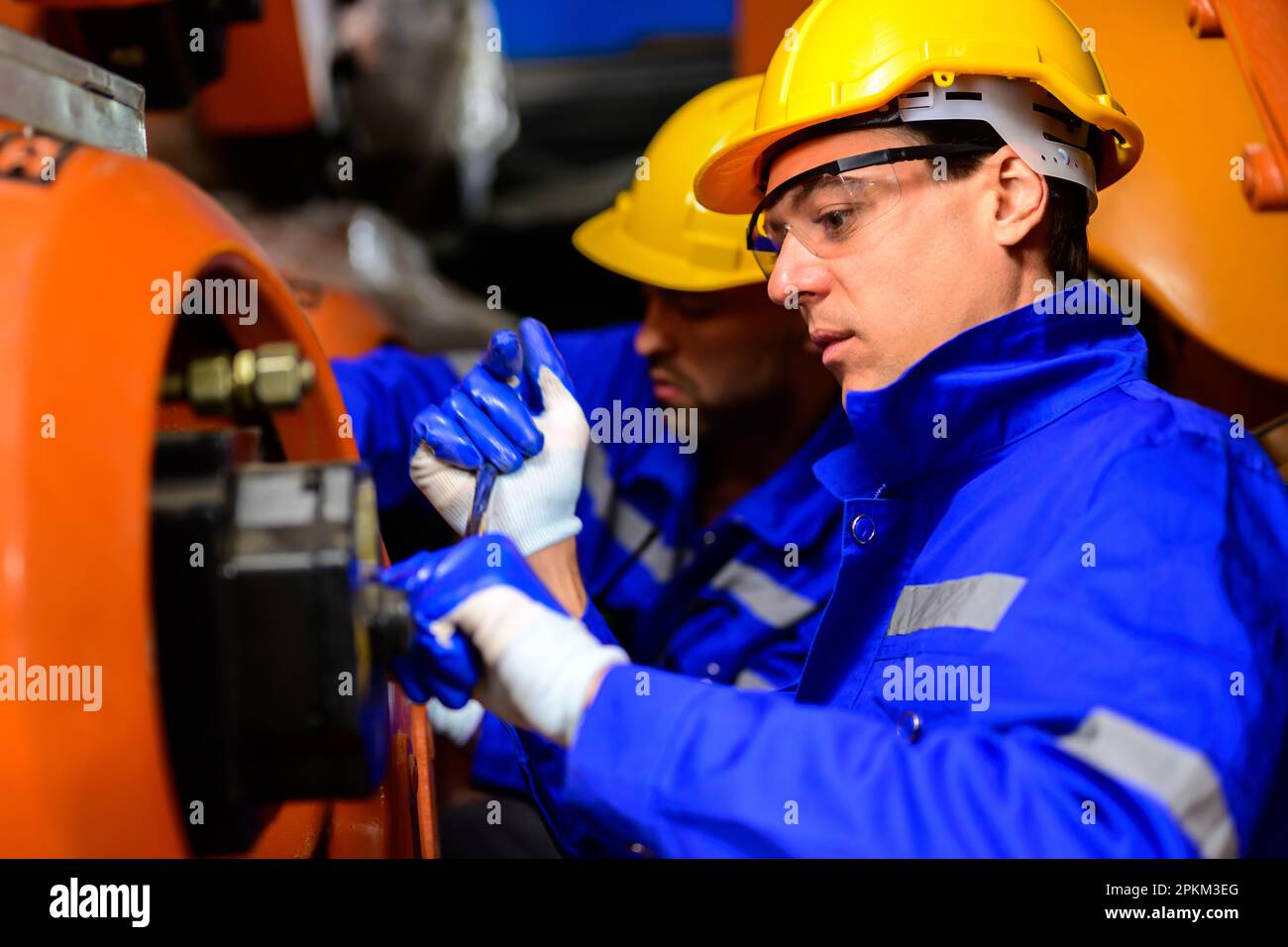 Professional engineers technicians working at industrial factory Stock ...