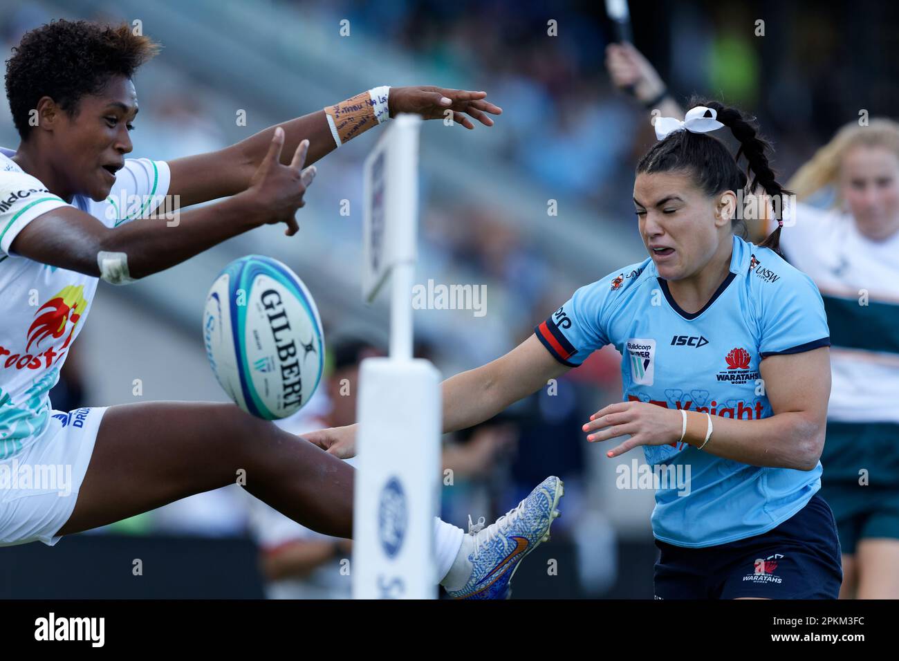 Adita Milinia of Fijiana Drua and Margot Vella of the Waratahs chase a ...