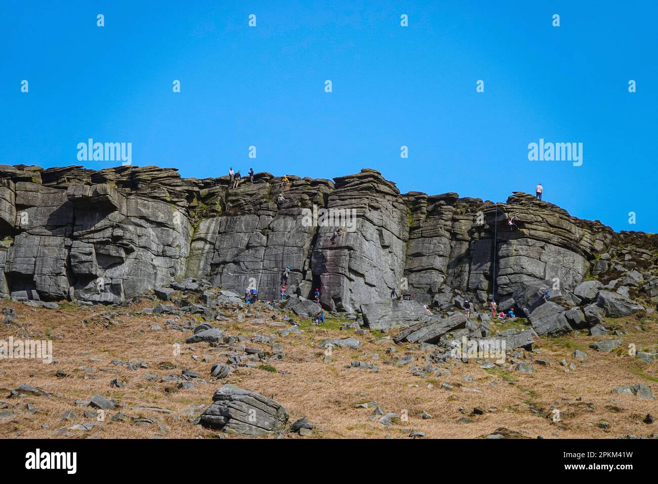 Rock climbers on High Neb, Stanage Edge, a gritstone cliff in the Peak ...