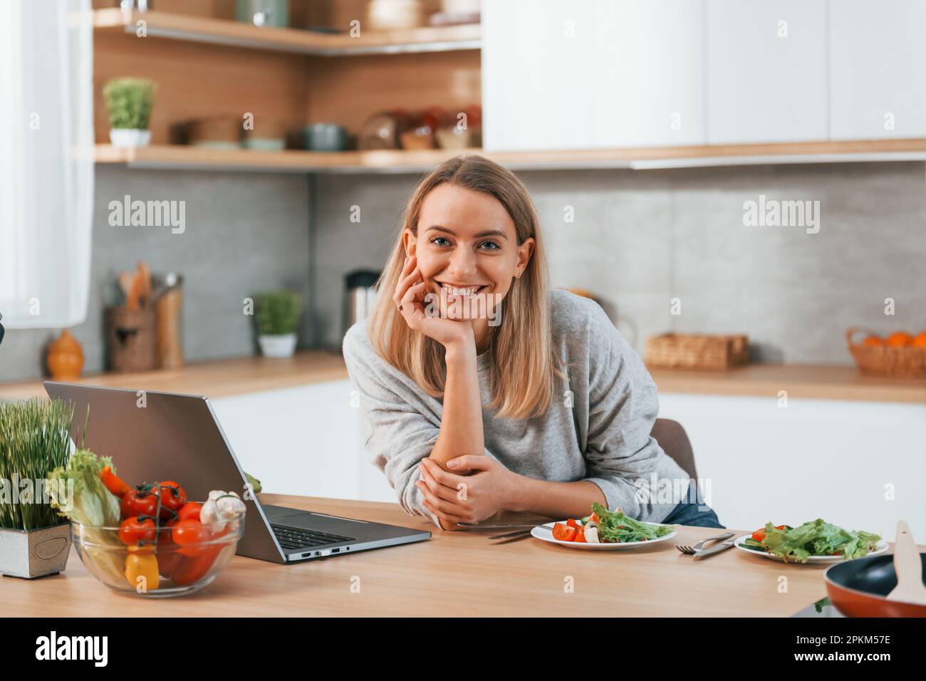 Woman preparing food at home on the modern kitchen Stock Photo - Alamy